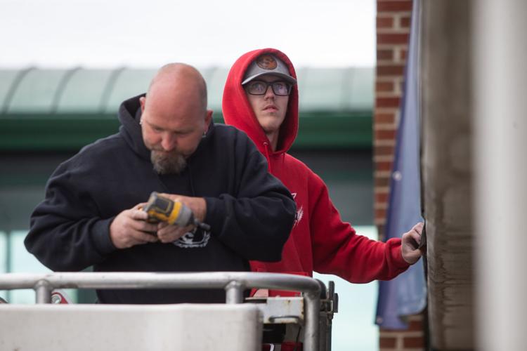 Don't look down: Employees add signage to Marshall parking garage ...
