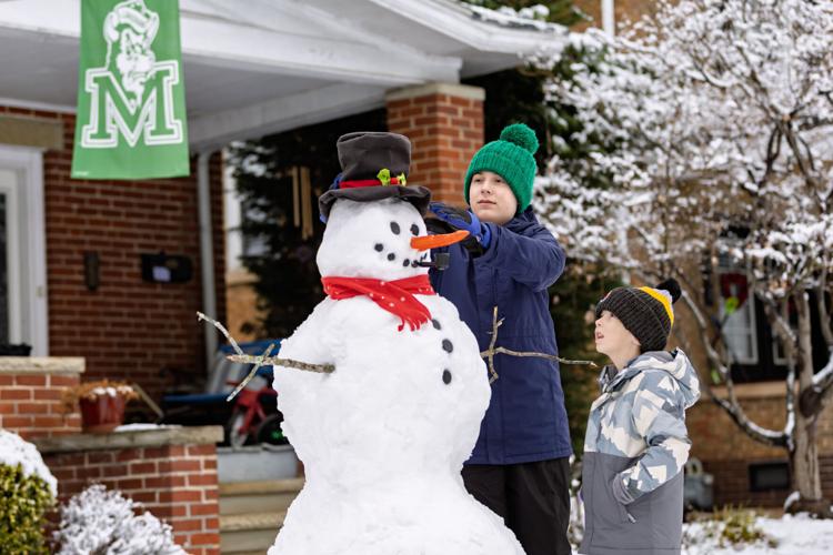 Sleds, shovels and snowmen: Huntington residents brave the cold for ...
