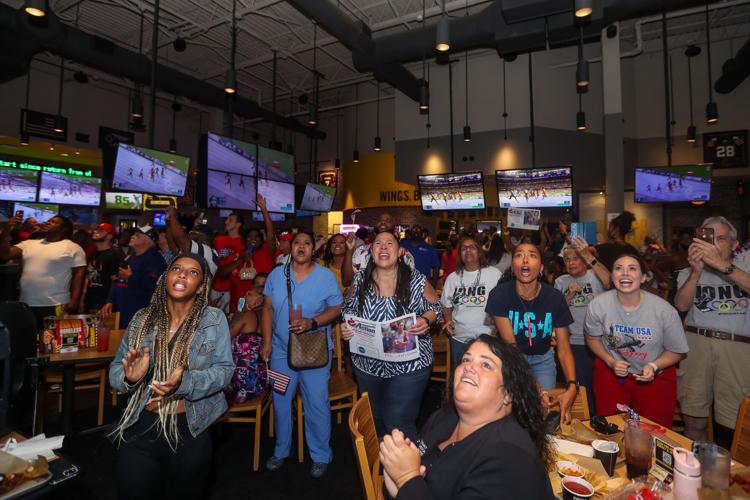 Photos: Watch party for Olympian McKenzie Long's 200-meter final run ...