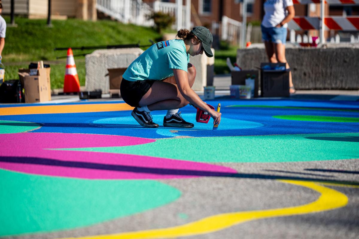 Volunteers help bring neighborhood asphalt art projects to life | News ...