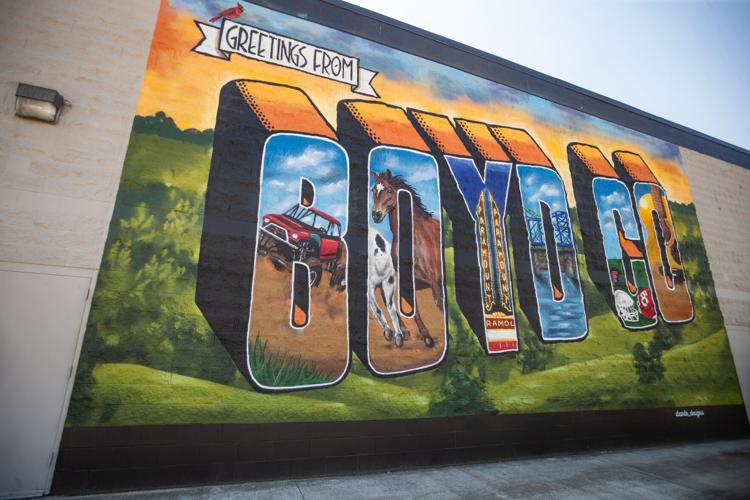 Artists return to hometown to paint mural | News | herald-dispatch.com