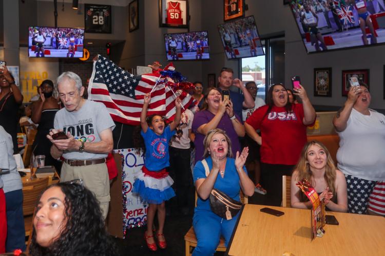 Photos: Watch party for Olympian McKenzie Long's 200-meter final run ...