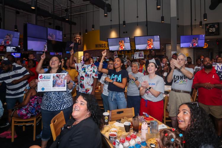 Photos: Watch party for Olympian McKenzie Long's 200-meter final run ...