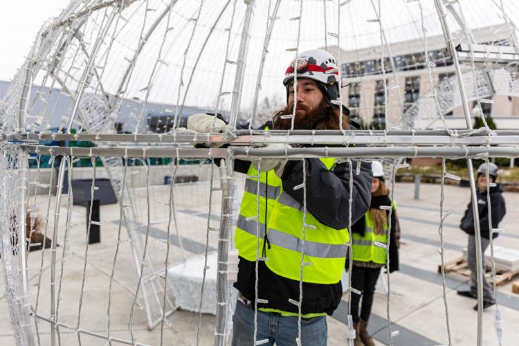 Photos: New holiday decorations installed at Mountain Health Arena ...