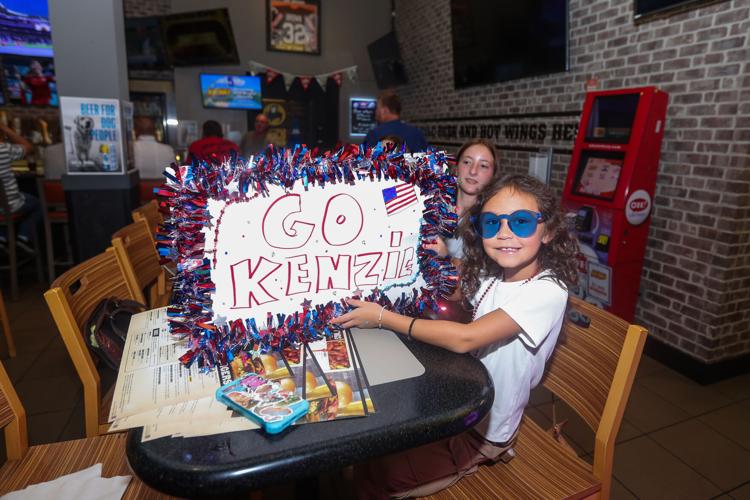 Photos: Watch party for Olympian McKenzie Long's 200-meter final run ...
