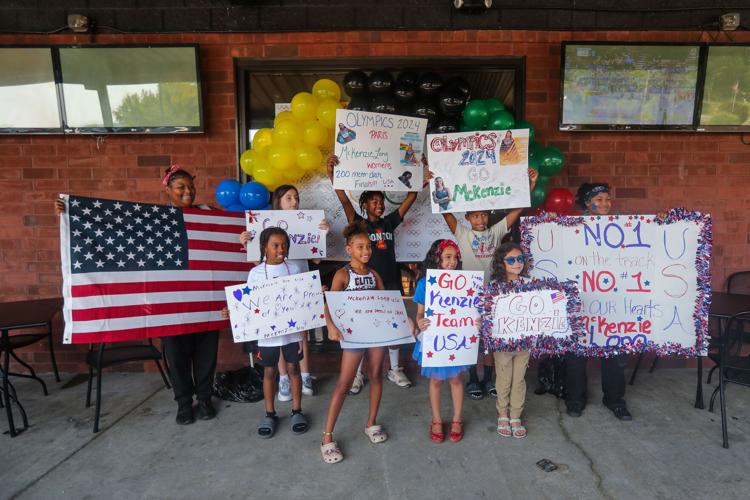 Photos: Watch party for Olympian McKenzie Long's 200-meter final run ...