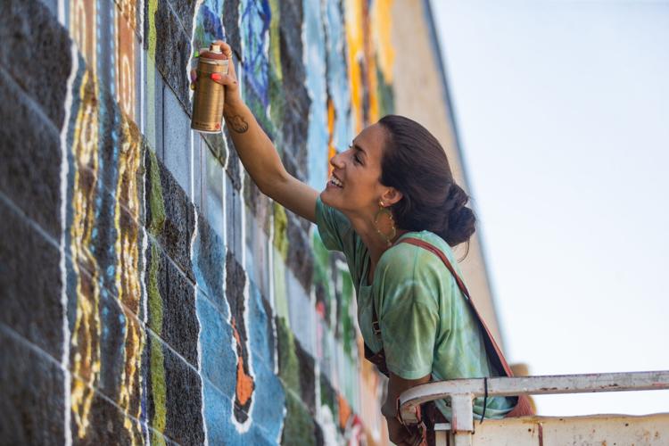 Artists return to hometown to paint mural | News | herald-dispatch.com