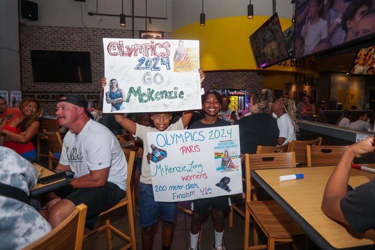 Photos: Watch party for Olympian McKenzie Long's 200-meter final run ...