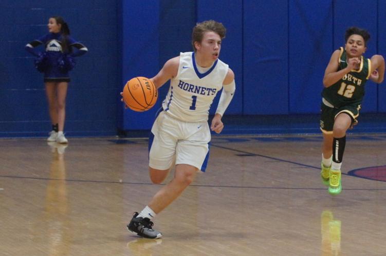 Trojans pull away late to top hosting Hornets | Local Sports ...