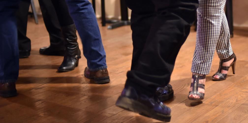 Couples enjoy dinner and dance lessons at downtown cafe