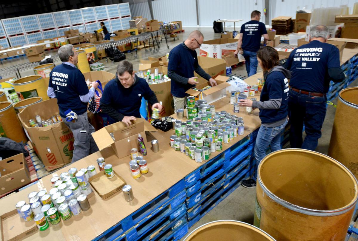 TVA employees, contractors volunteer a day to box food for local agencies