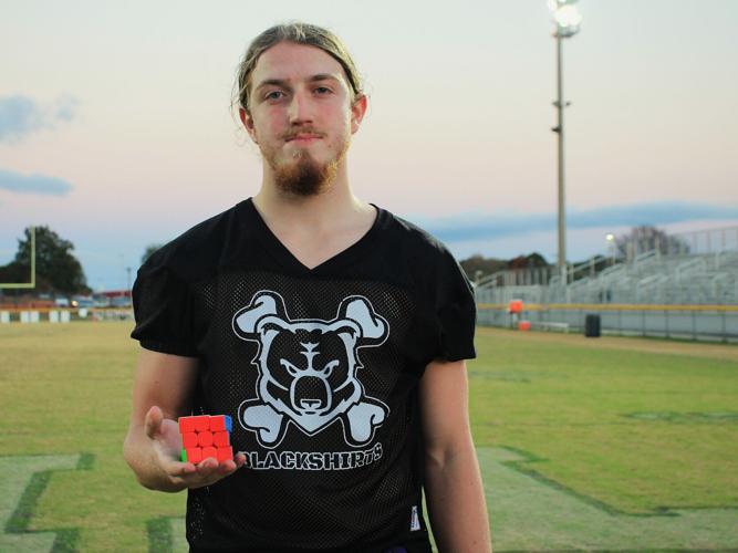 Bunker Hill NC football player solves Rubik's Cubes quickly