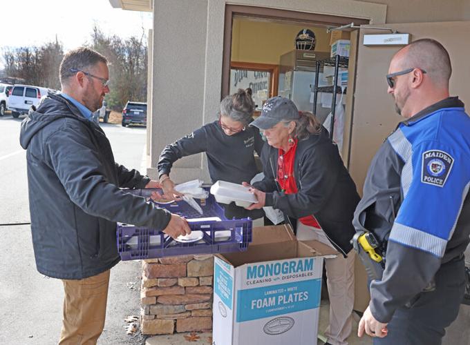 Maiden police officers deliver meals to elderly citizens for Christmas