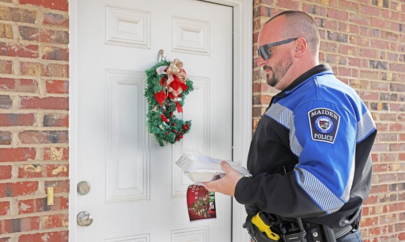 Maiden police officers deliver meals to elderly citizens for Christmas
