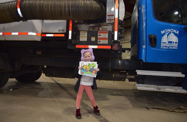 Girl gets ride in Monona leaf truck after winning coloring contest ...