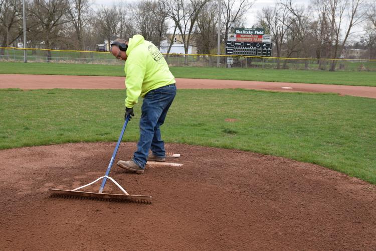 Preparing Waterloo’s Skalitzky Field for the night’s ball game ...
