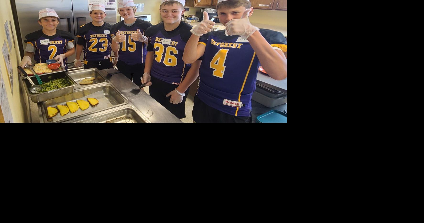 DeForest football players serve up lunch at the senior center | Local ...