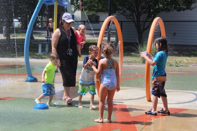 COOLING OFF: photos of Milton splashing around at Goodrich Square ...