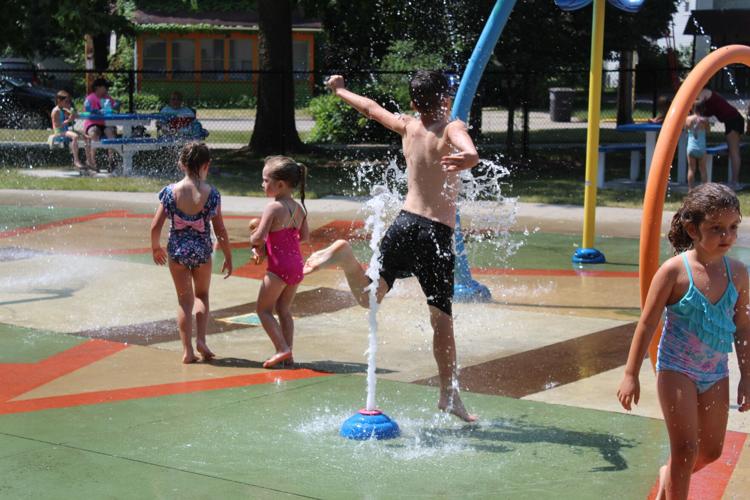 COOLING OFF: photos of Milton splashing around at Goodrich Square ...