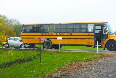 Car rear ends school bus | News | hngnews.com