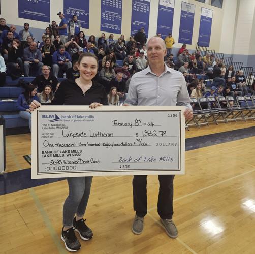 Bank of Lake Mills presents checks from purchases made with mascot ...