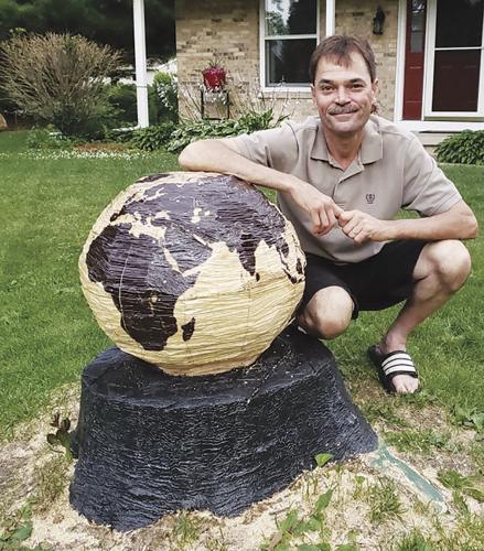 Waunakee artist makes globe out of dead tree stump | Waunakee Tribune ...