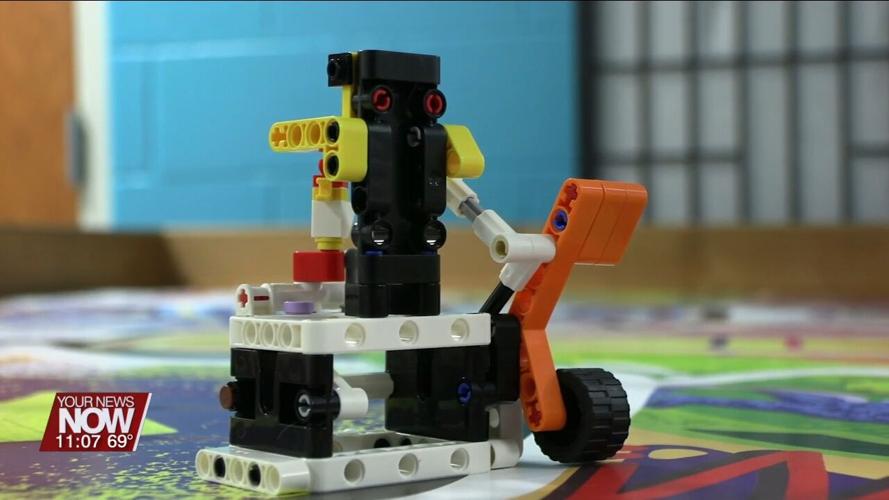 Kids work on collaborative and STEM skills with the Lego program at ...