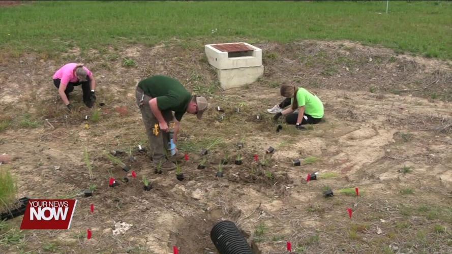 Employees from the Lima Ford Engine Plant volunteer and lend a hand at ...