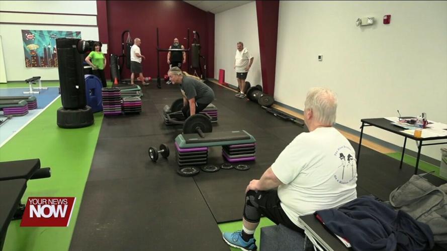 Strongman competitor and world record holder begins a workout class for ...