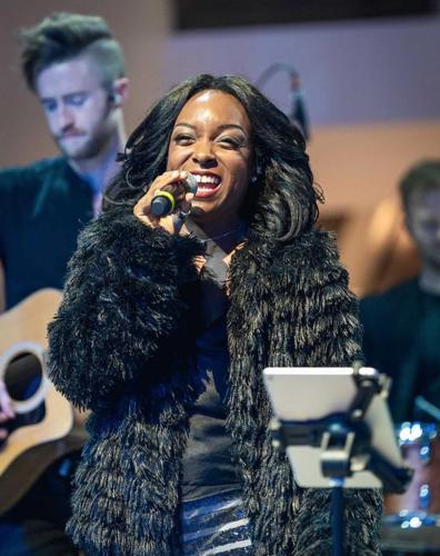 Singer pays tribute to Aretha, Whitney in benefit concert | Life ...