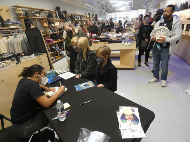 This week in photos: Winter arrival, gallery opening and a book signing ...