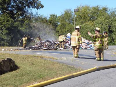 Garbage truck drops flaming trash in Concord parking lot