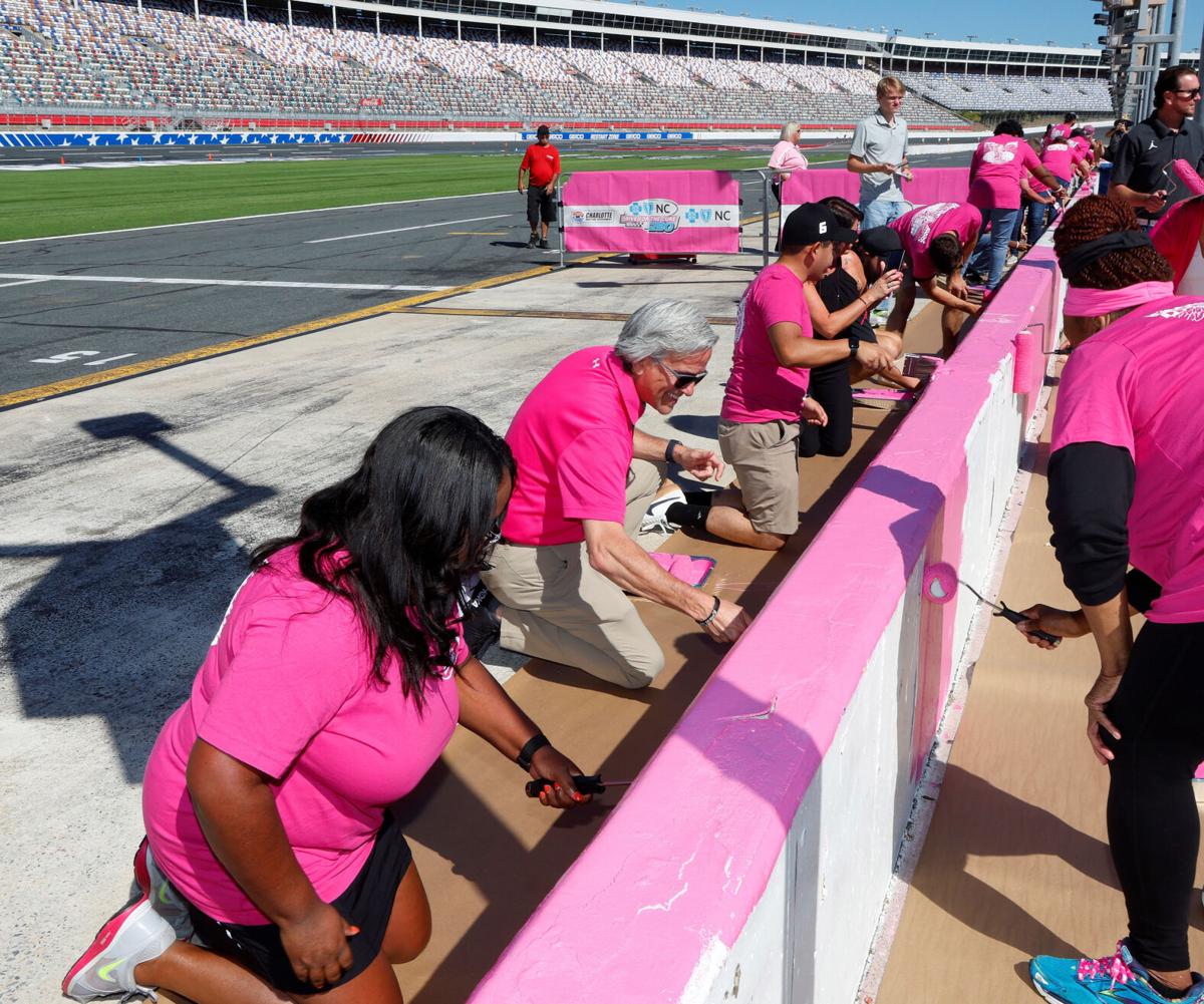Paint pink: Breast cancer survivors, Kurt Busch paint pit wall for ...