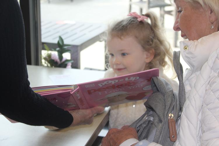 Look at books: Greenwood library, eatery unite to promote reading to ...