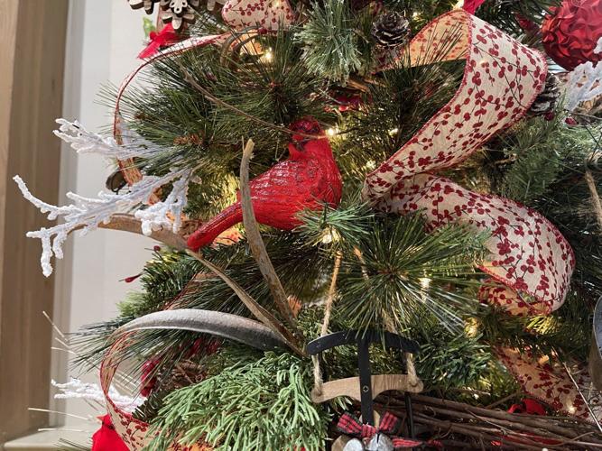 Wrapping up: Softball team pitches in to ready Hospice festival trees ...