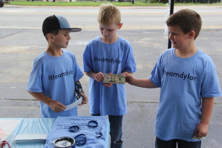 Dylan Strong: 9-year-old raises $6K for brother by selling lemonade ...