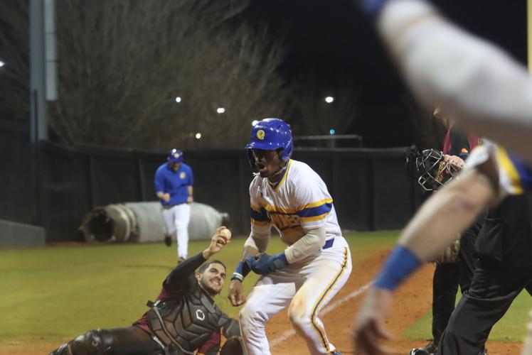 Garrett steals home in extras, lifts Lander baseball to season-opening ...