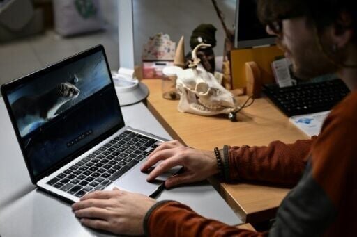Doctoral student Marco Granata studies videos of ermines who enter his ...