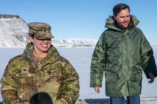 US Vice President JD Vance (R) walks with Colonel Susan Meyers ...