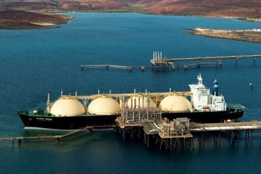 An LNG tanker berthed at the Karratha gas plant loading terminal in ...