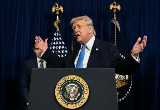 US Secretary of State Marco Rubio (L) looks on as US President Donald ...