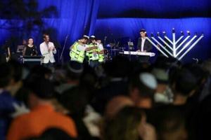 Paramedics, police and parents of the wounded were invited on stage to ...