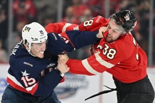 United States forward Matthew Tkachuk, at left, fighting Canada's ...