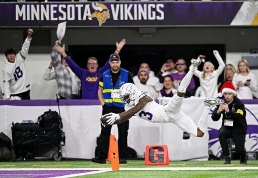 Minnesota's Jordan Addison caps a 65-yard touchdown run with a dive ...