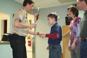 Webelo Paul Kobylorz receives the Arrow of Light from Cubmaster Mark ...
