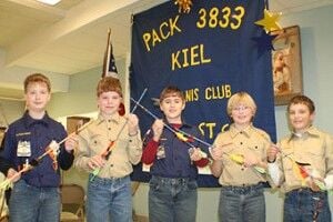 Webelo Paul Kobylorz receives the Arrow of Light from Cubmaster Mark ...