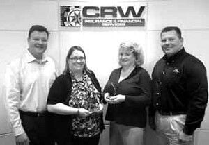 Employees received plaques distinguishing their years of service ...