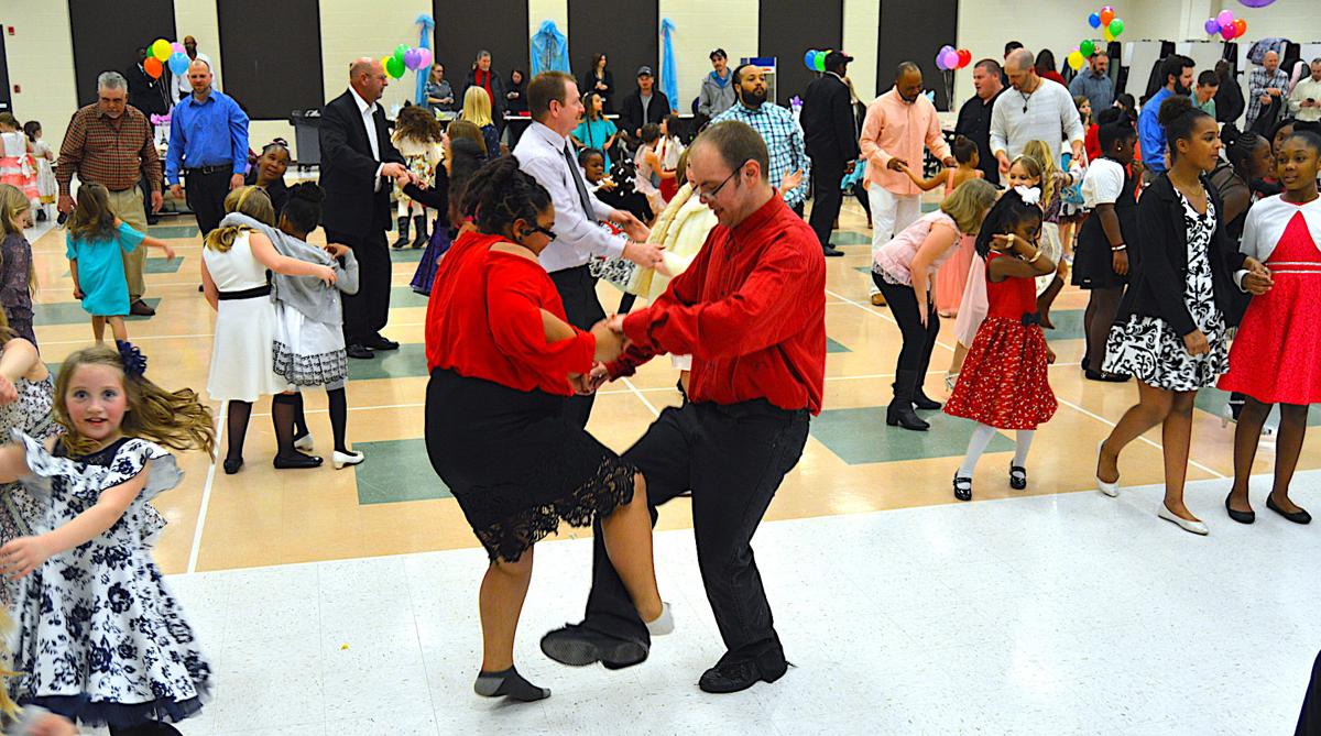 Daughtry Elementary brings Parisian theme to daddy-daughter dance ...