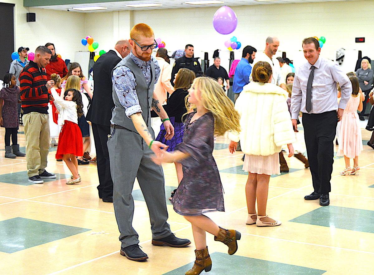 Daughtry Elementary brings Parisian theme to daddy-daughter dance ...