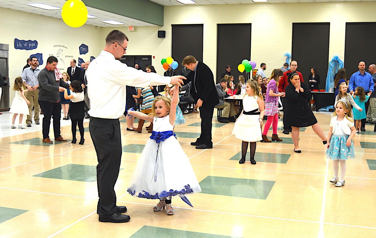 Daughtry Elementary brings Parisian theme to daddy-daughter dance ...